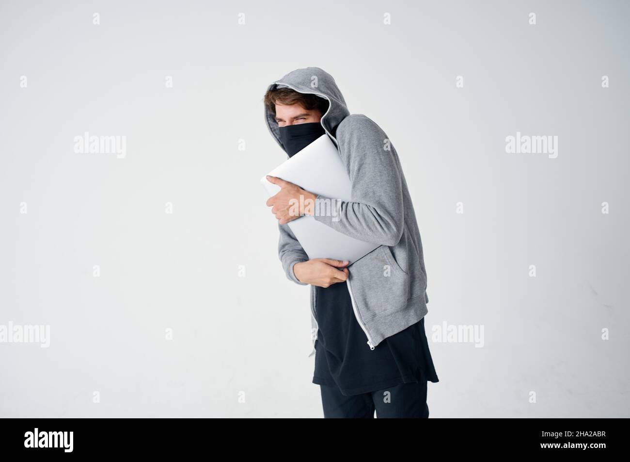 masked man hooded head hacking technology security Lifestyle Stock Photo - Alamy