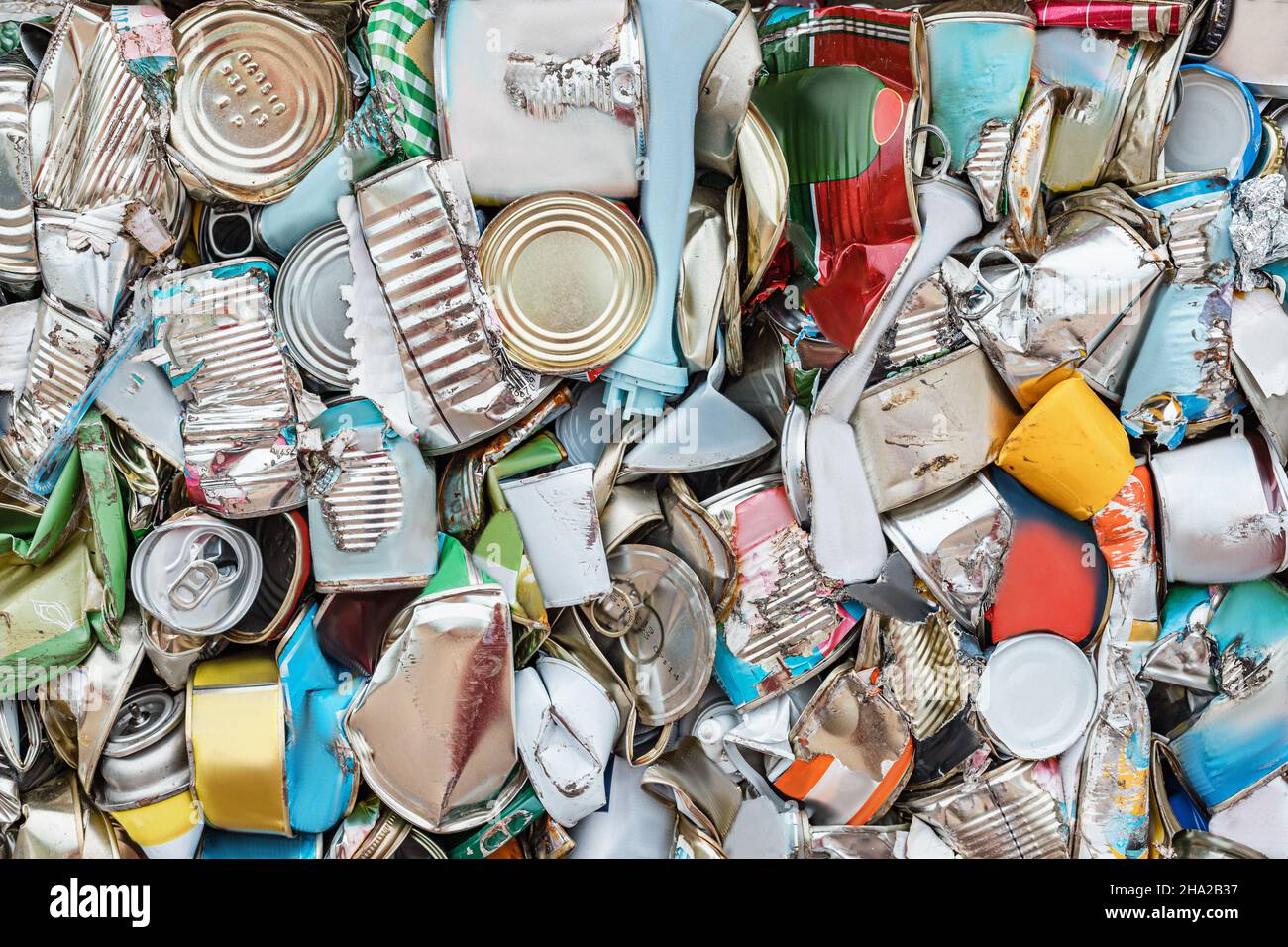 Metal tin and aluminum cans compressed by a press and packed in pallets ...