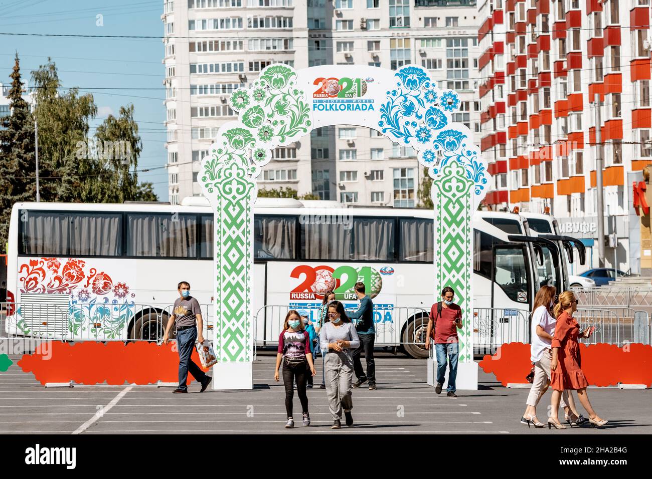 06 July 2021, Ufa, Russia: People wearing face masks at the entrance to ...