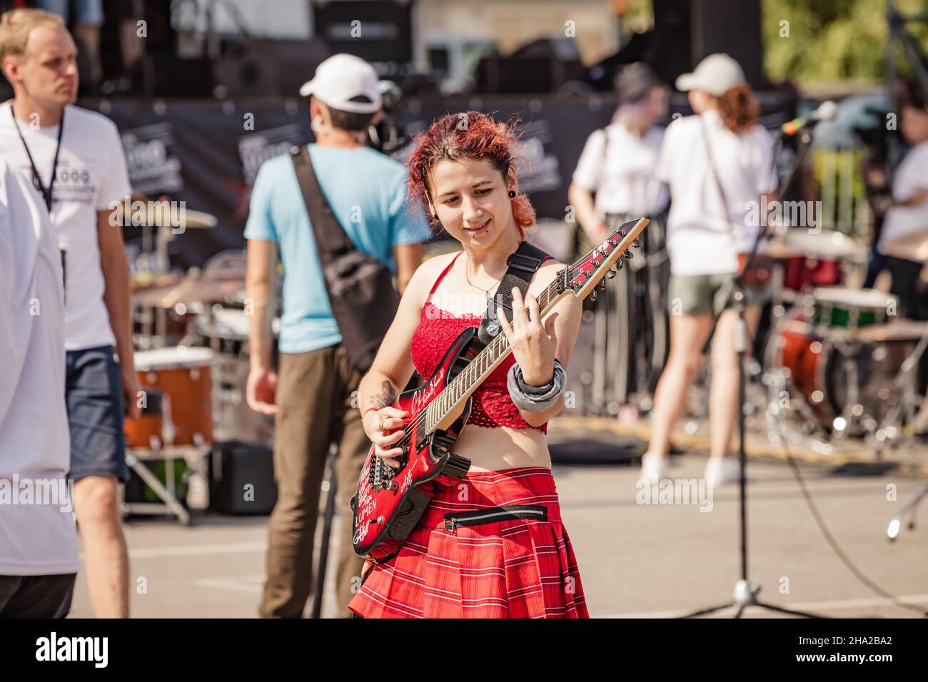 21 August 2021, Ufa, Russia: A punk or metalhead girl plays an electric ...