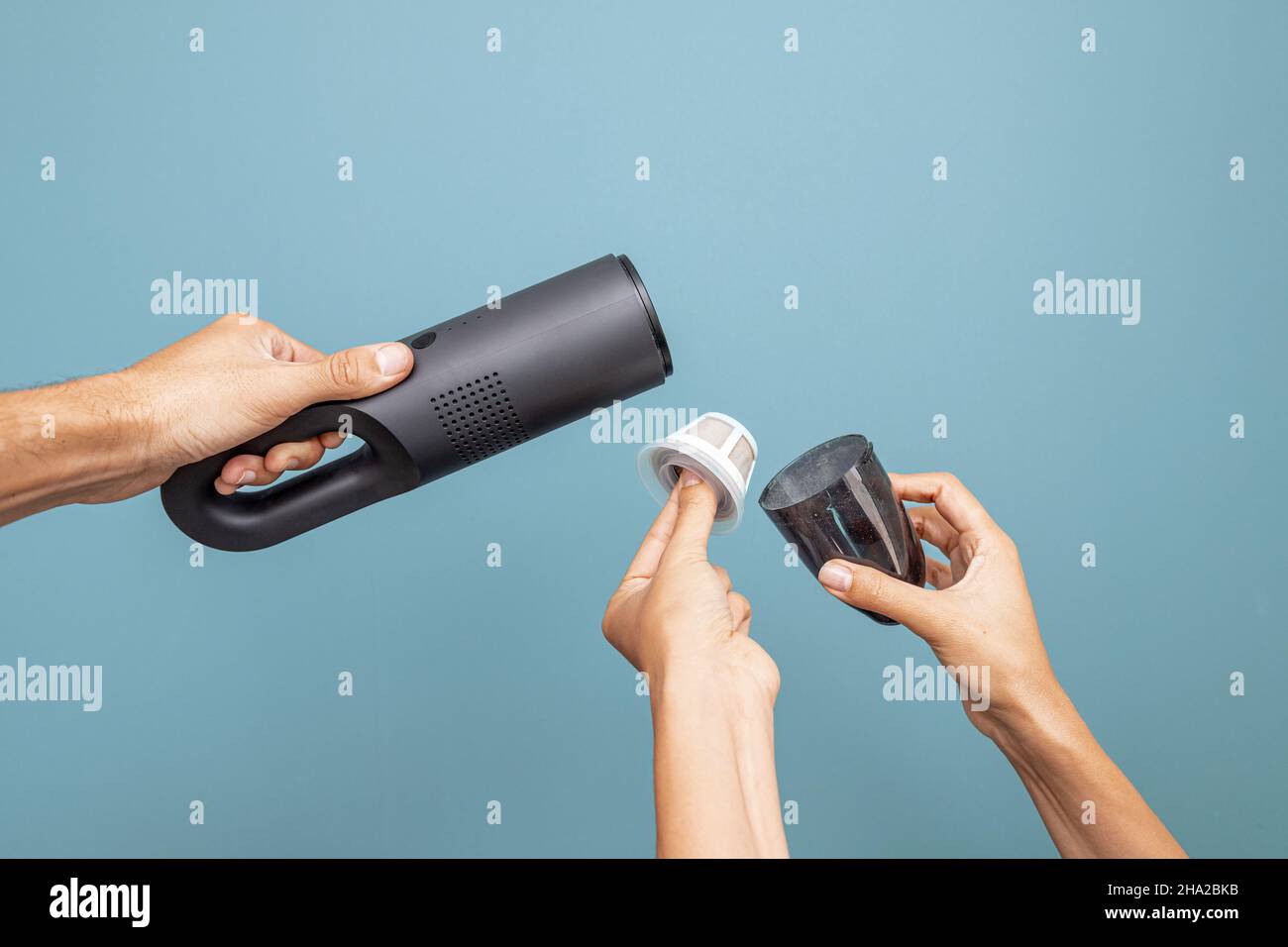 Disassembled manual vacuum cleaner for home and car. Dust collector and ...