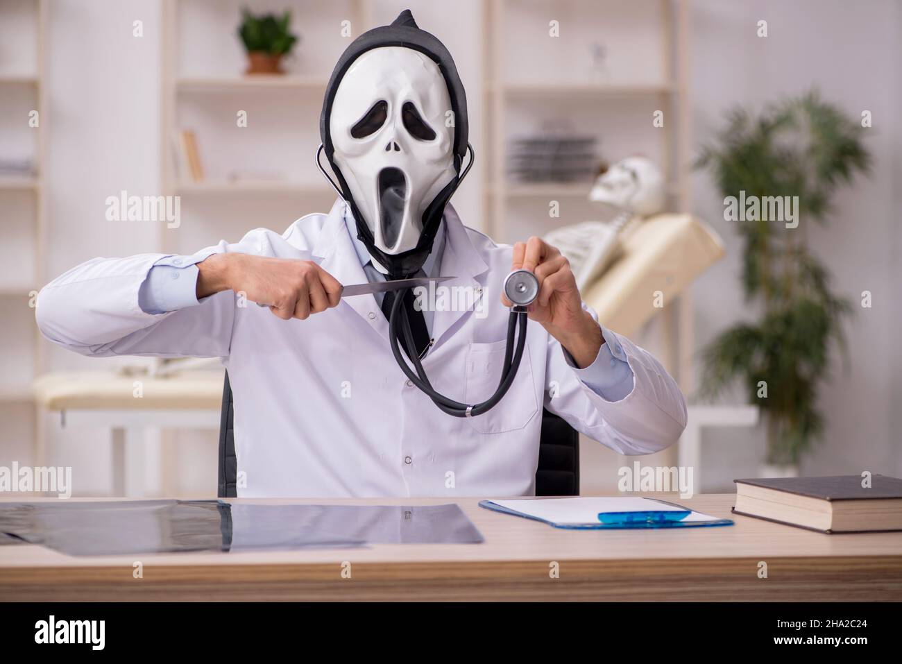 Devil doctor working at the hospital Stock Photo - Alamy