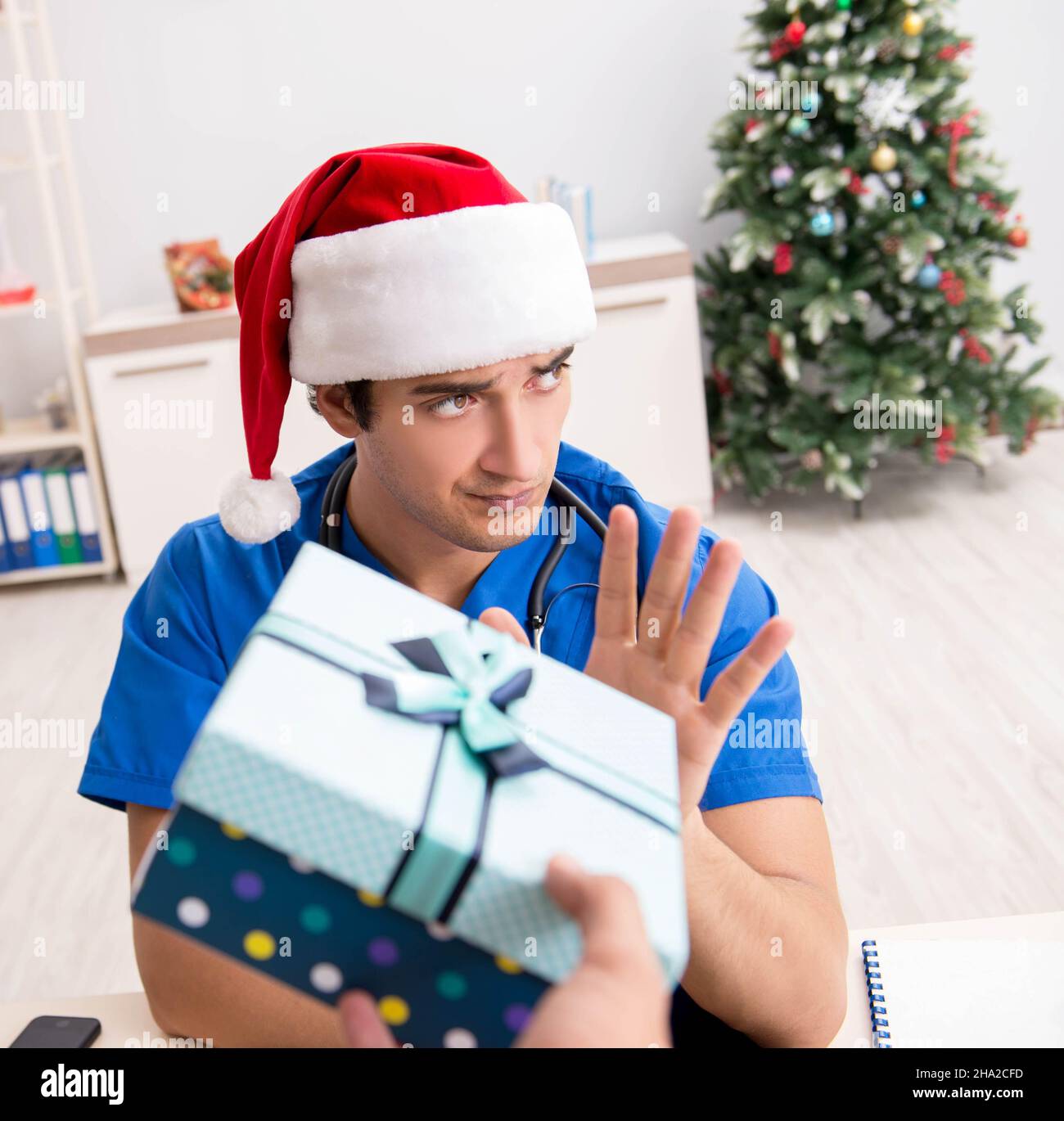 The doctor with gift box in the hospital Stock Photo - Alamy