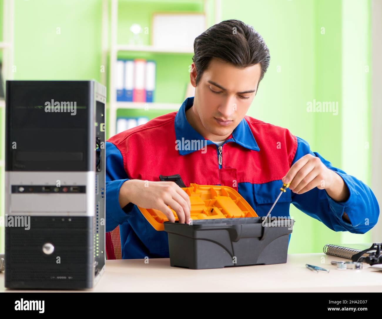 The computer engineer repairing broken desktop Stock Photo - Alamy