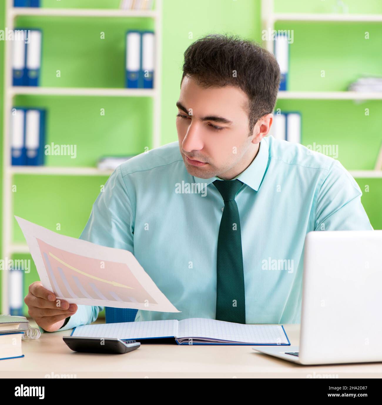 The male financial manager working in the office Stock Photo - Alamy