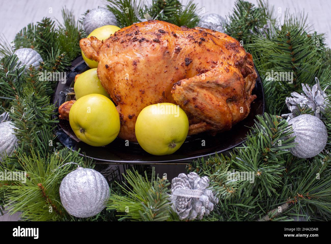Christmas food. Fried stuffed chicken, turkey with green apples on a ...