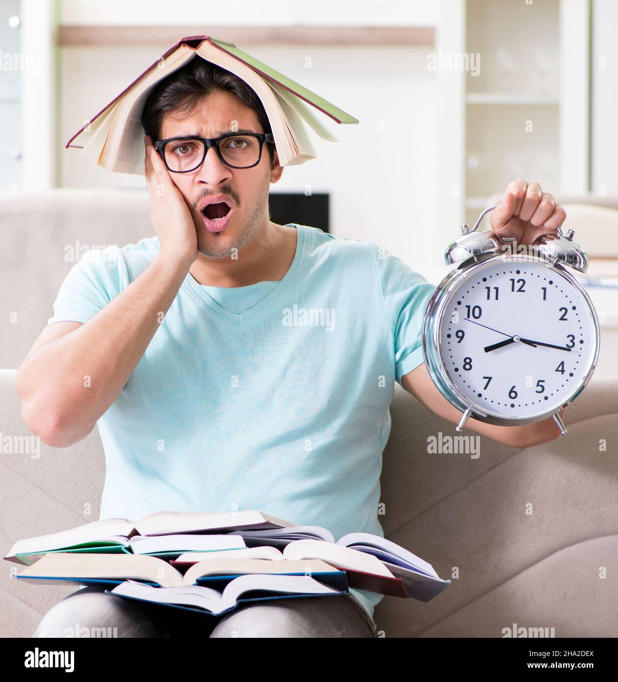 Student preparing for university exams at home in time management ...