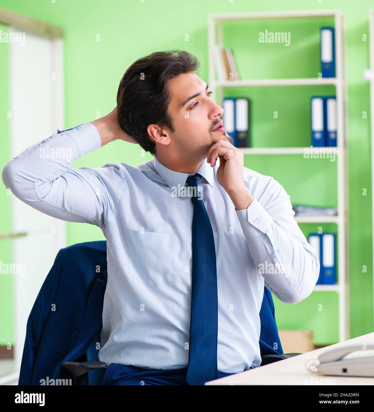 The employee doing exercises during break at work Stock Photo - Alamy