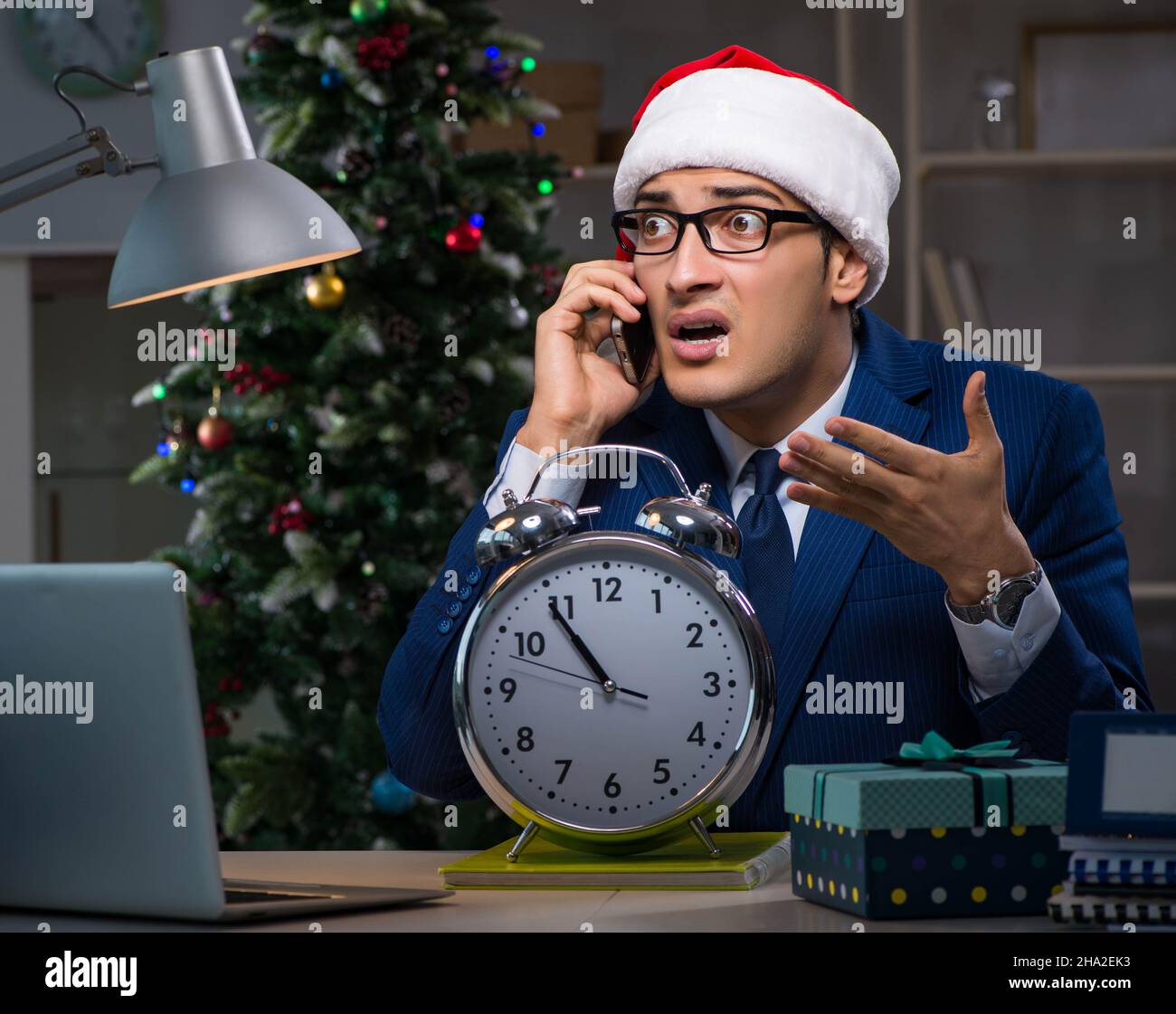 The businessman working late on christmas day in office Stock Photo - Alamy