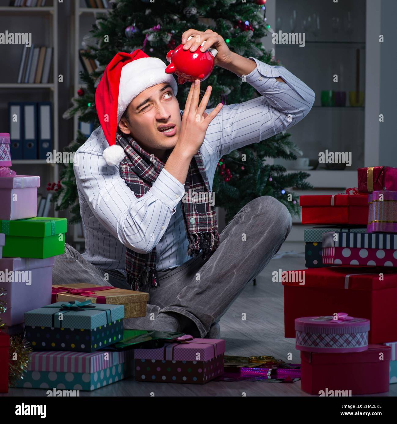 The man with many christmas gifts in boxes Stock Photo - Alamy