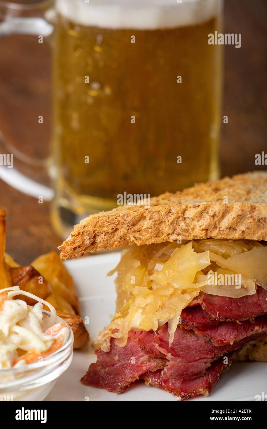 reuben sandwich on a plate with fries Stock Photo - Alamy