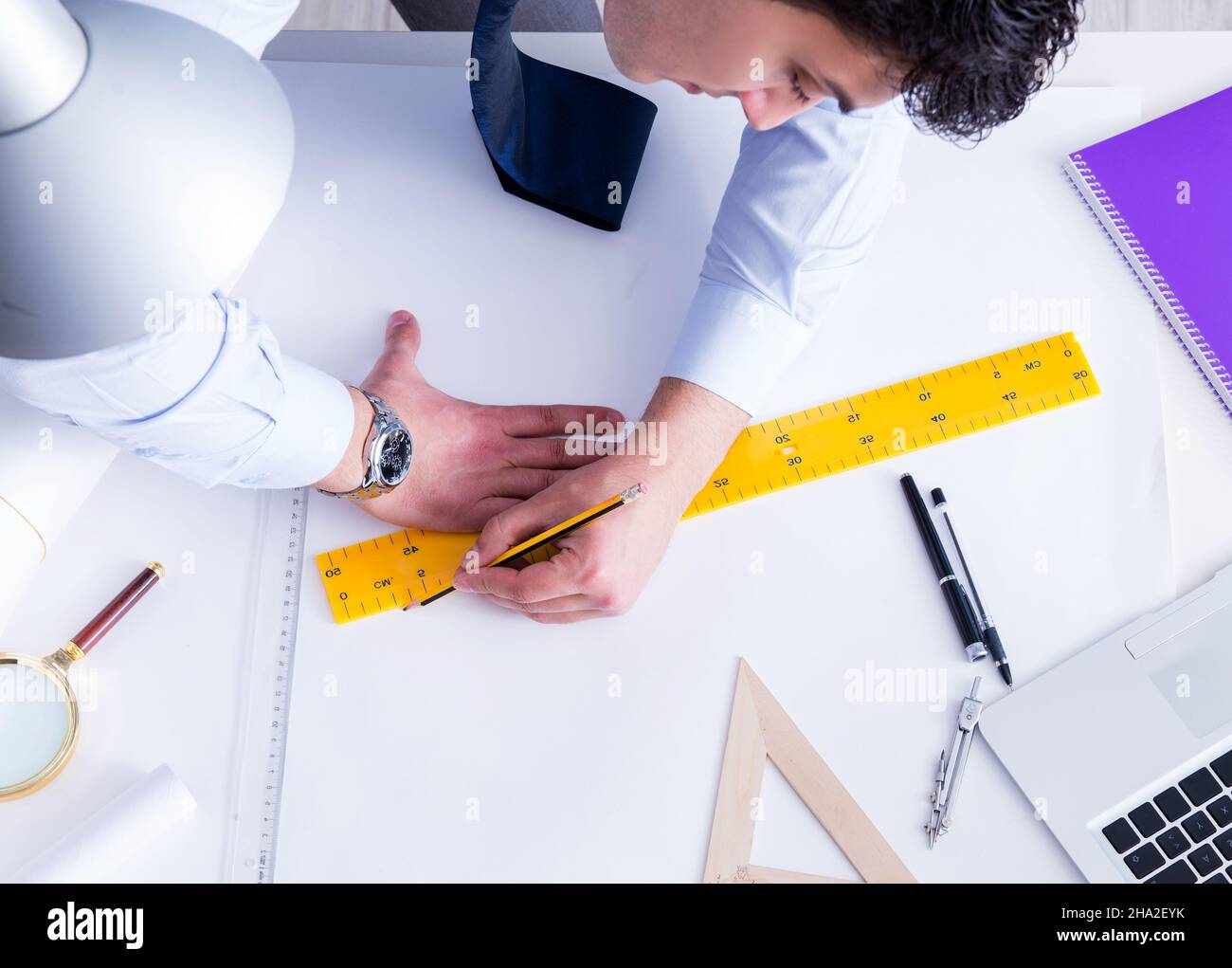The engineer working on new project drawings Stock Photo - Alamy