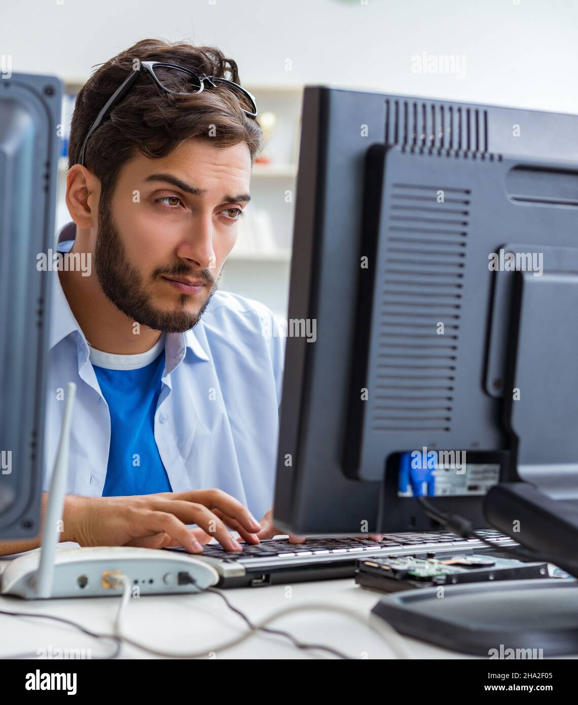 The it technician looking at it equipment Stock Photo - Alamy