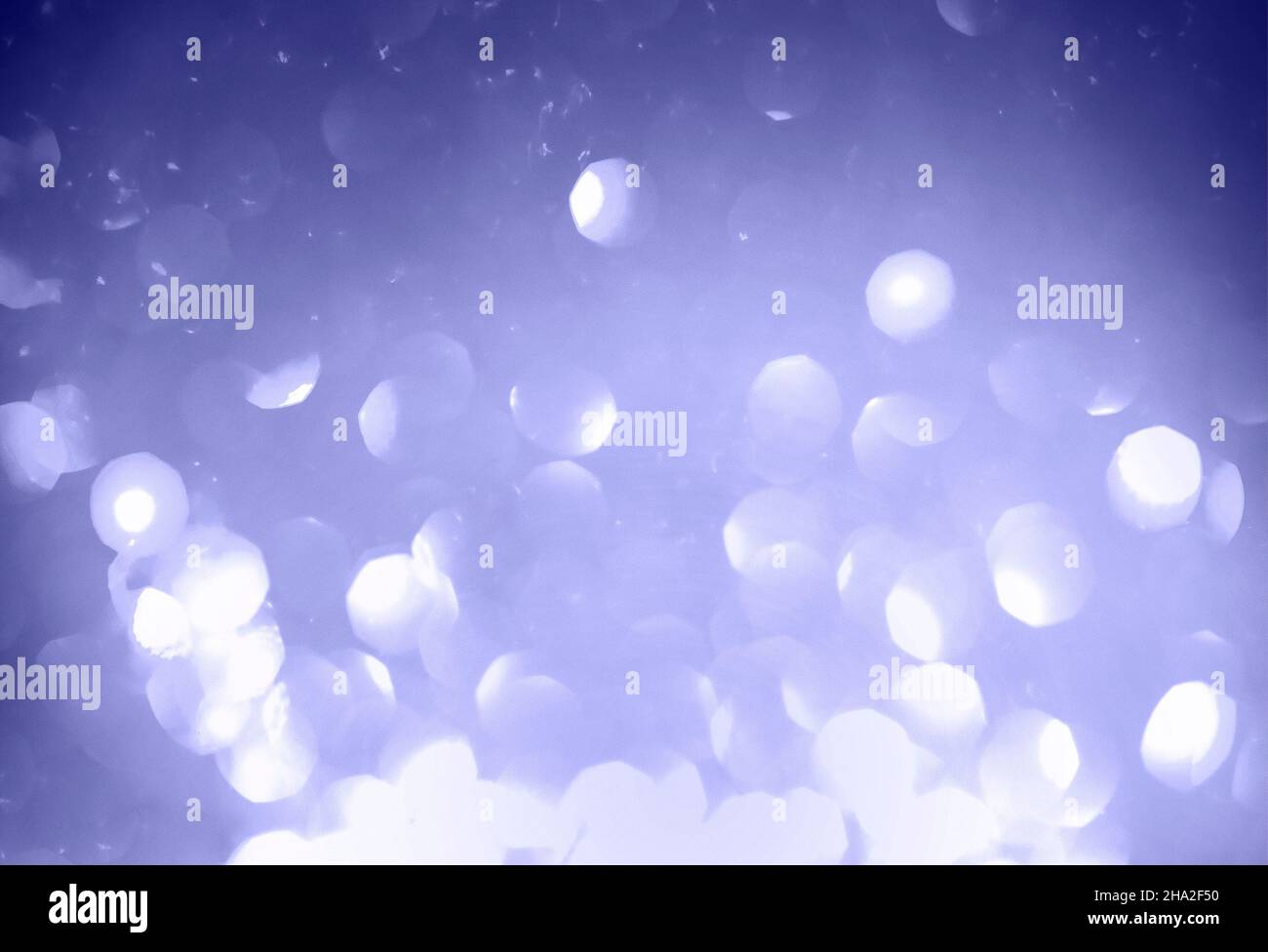 Abstract background of bright spots of lights shining with very peri ...