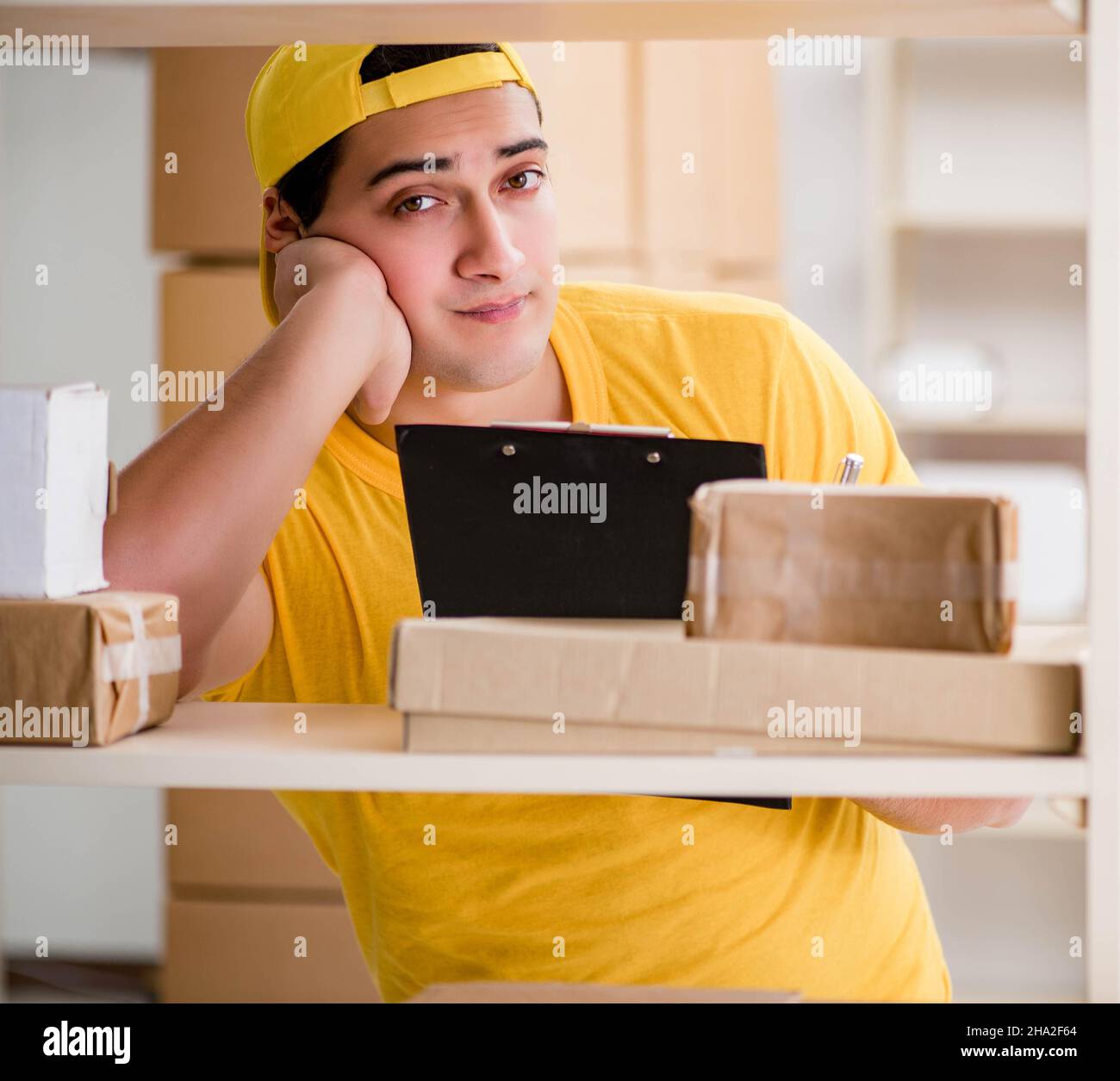 The man working in postal parcel delivery service office Stock Photo ...