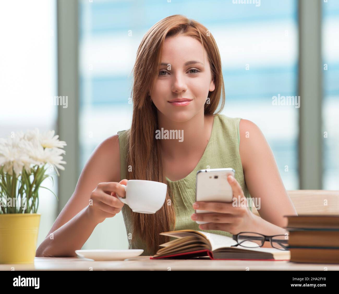 The young student preparing for exams drinking tea Stock Photo - Alamy