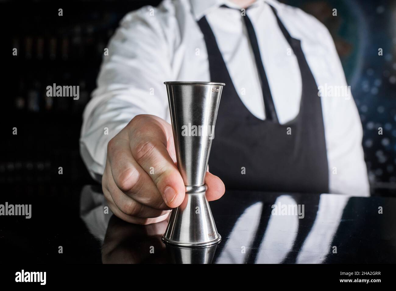 Hand pouring liquor isolated hi-res stock photography and images - Alamy