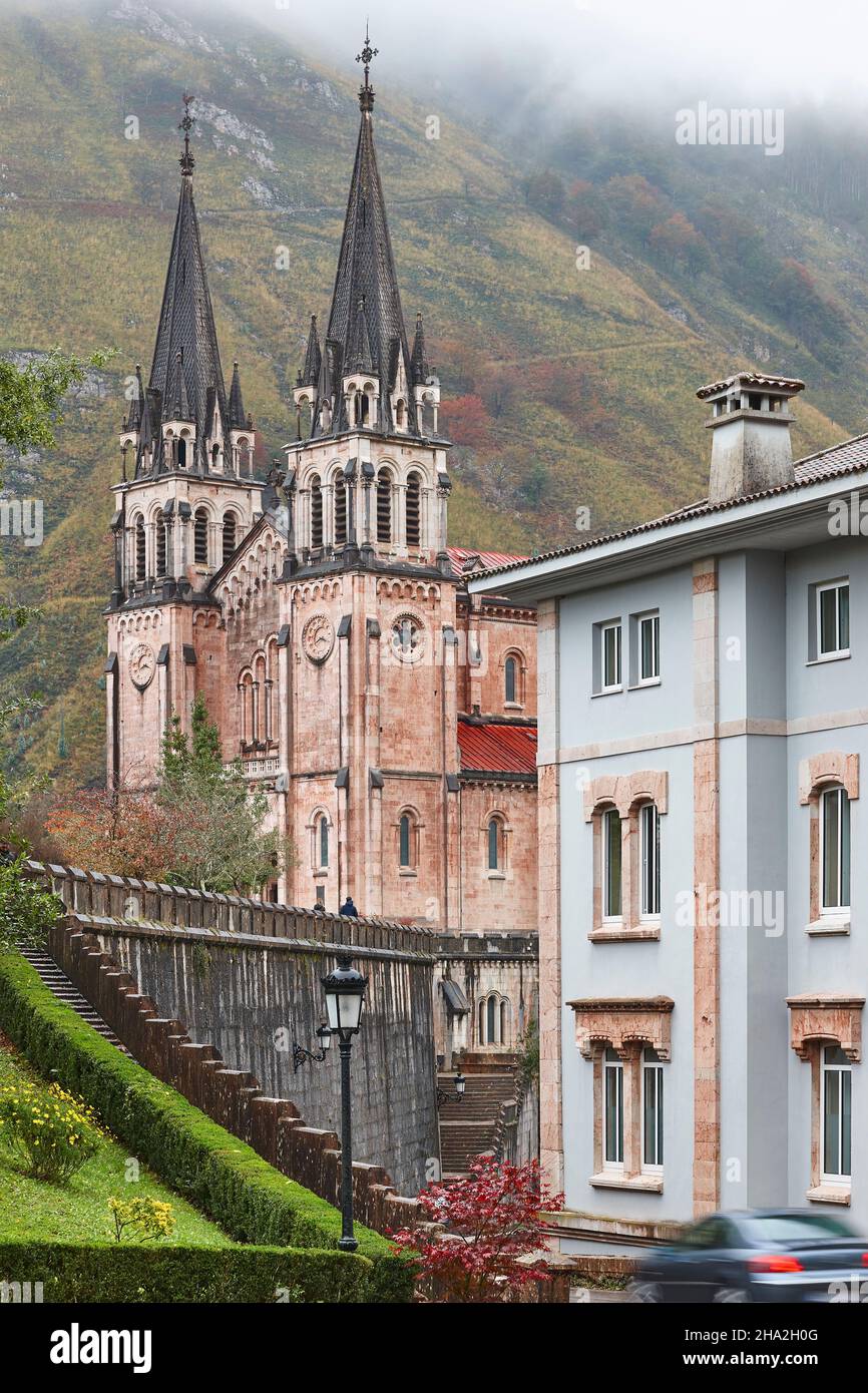 Picturesque red stone basilica and mountains in Covadonga. Asturias ...