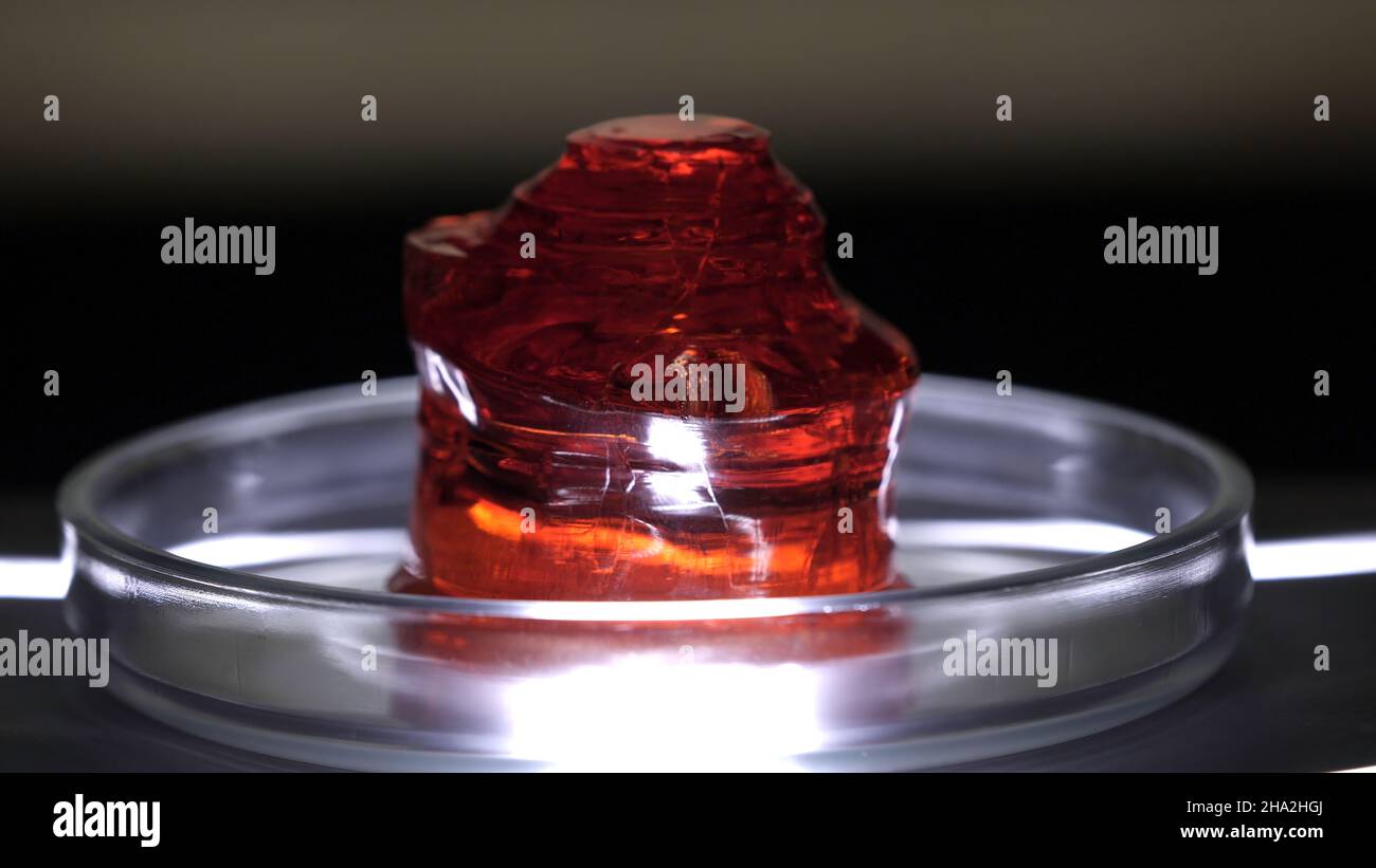 Close-up of red translucent mineral. Sample of red mineral on clean ...