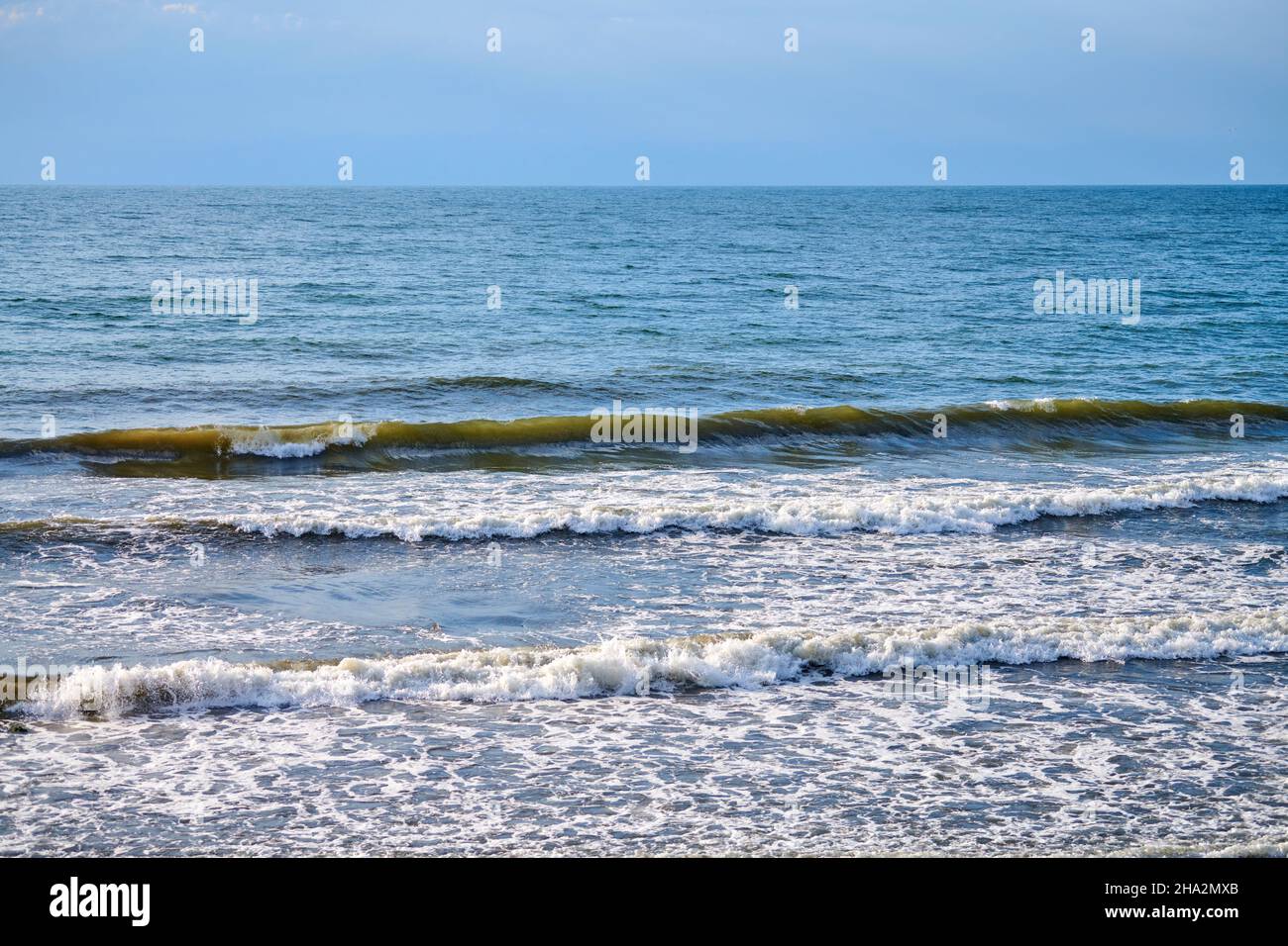 Deep blue sea waters splashing with foamy waves. Seaside view of ocean ...