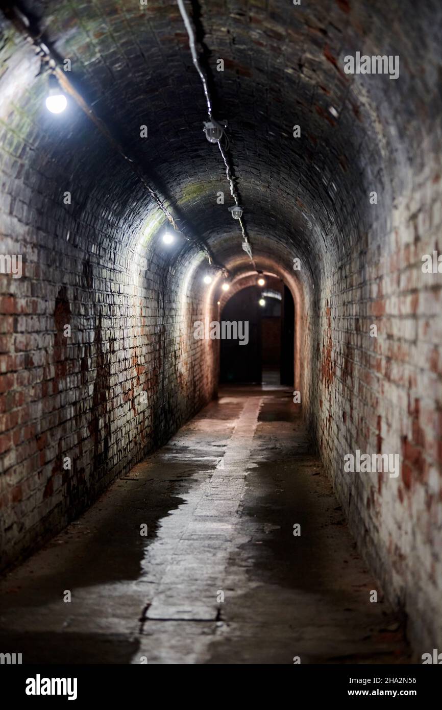 Brick tunnel in old German fort, red brick loft corridor with old ...