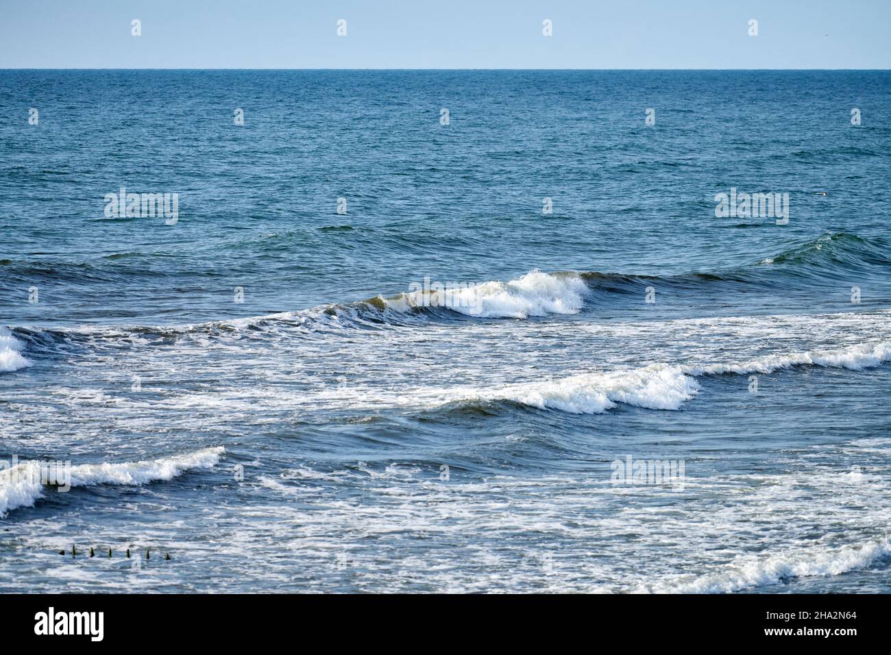 Deep blue sea waters splashing with foamy waves. Seaside view of ocean ...