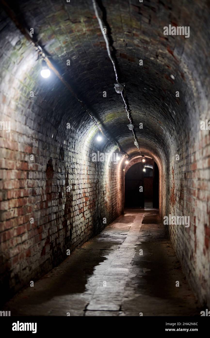Brick tunnel in old German fort, red brick loft corridor with old ...