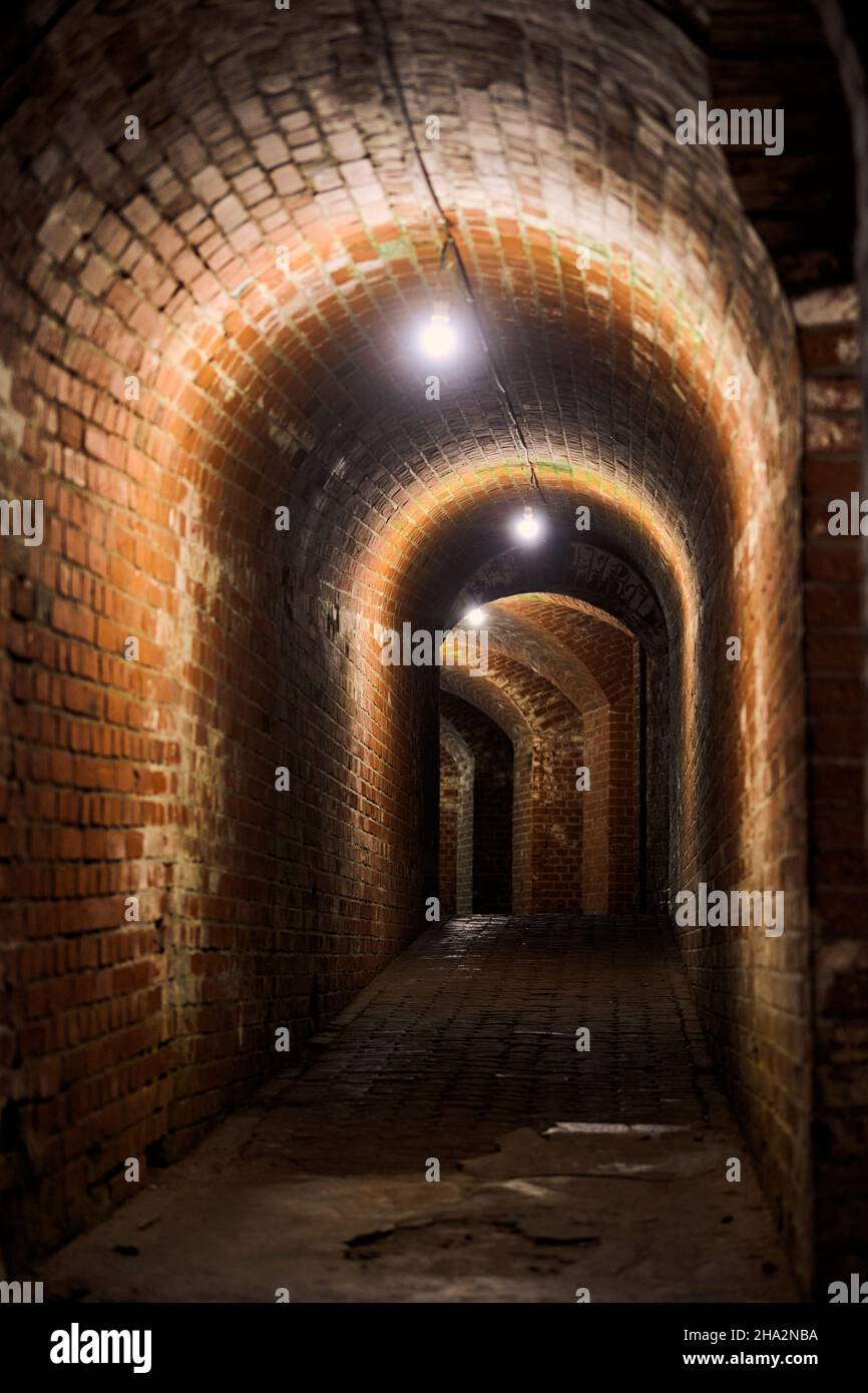 Brick tunnel in old German fort, red brick loft corridor with old ...