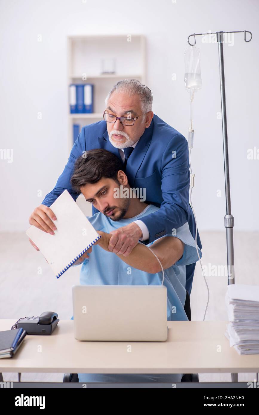 Young employee feeling bad at workplace Stock Photo - Alamy