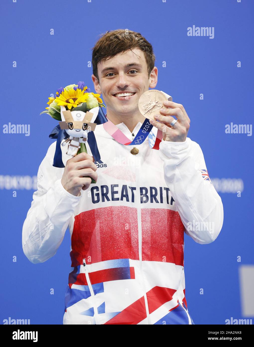 Tom Daley of Britain poses with his bronze medal for the men's 10-meter ...