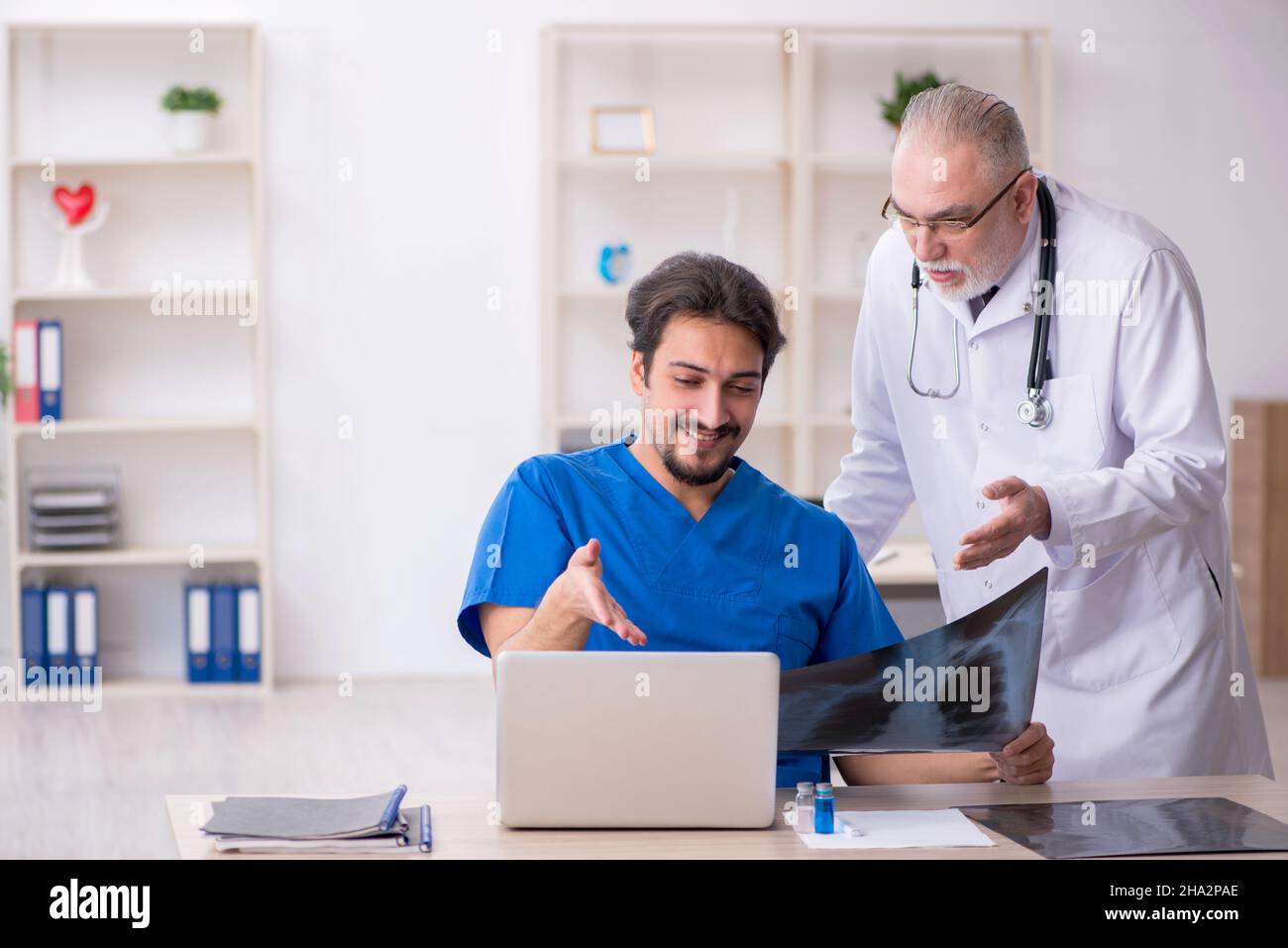 Two doctors working in the clinic Stock Photo - Alamy
