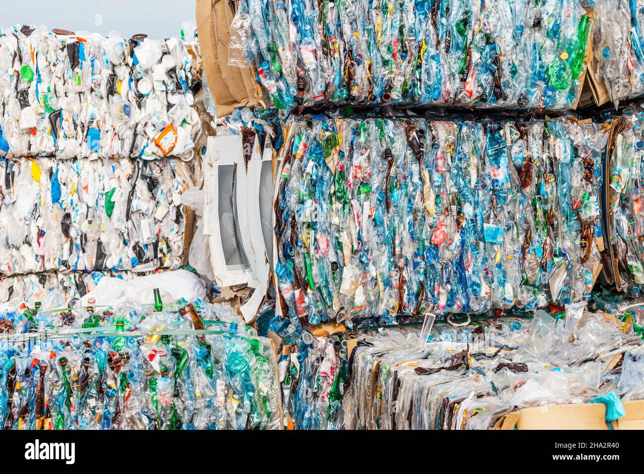 A lot of plastic garbage is compressed by a press and bound into ...