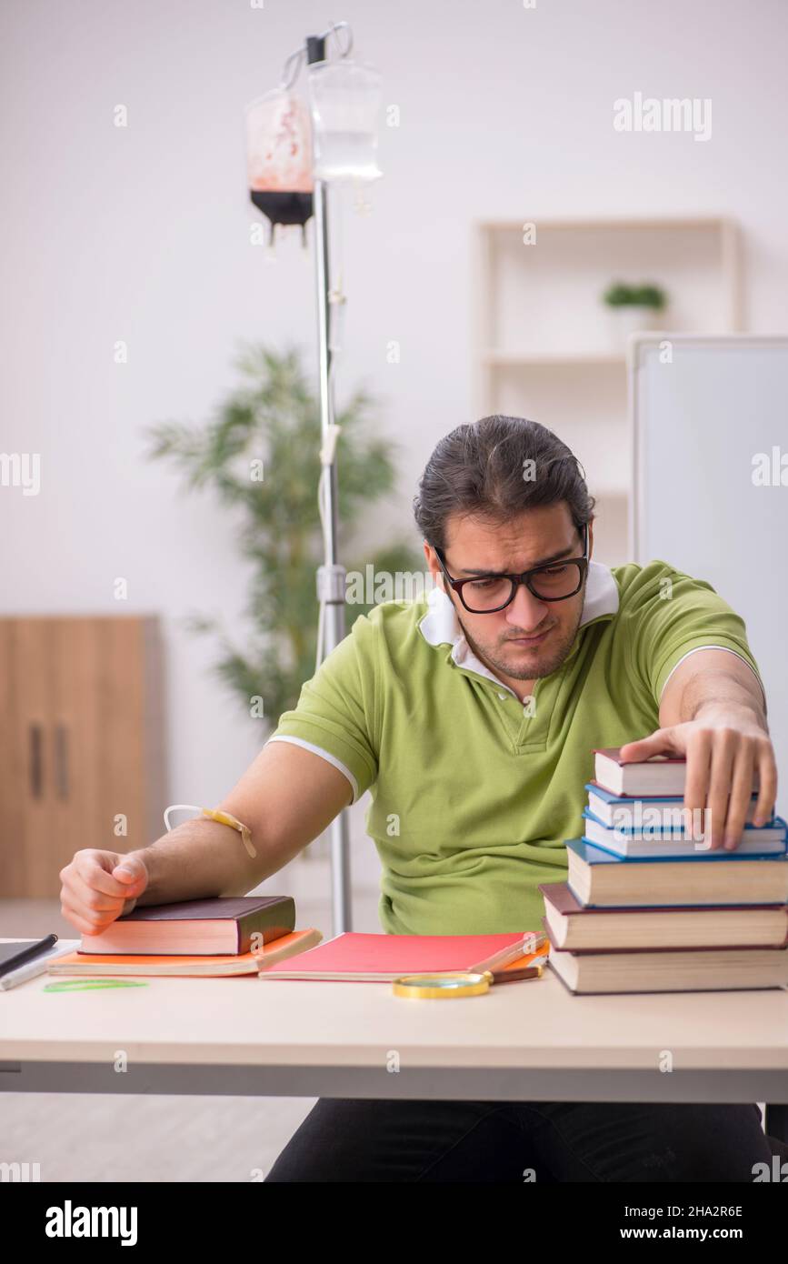 Young sick teacher student in blood transfusion concept Stock Photo - Alamy