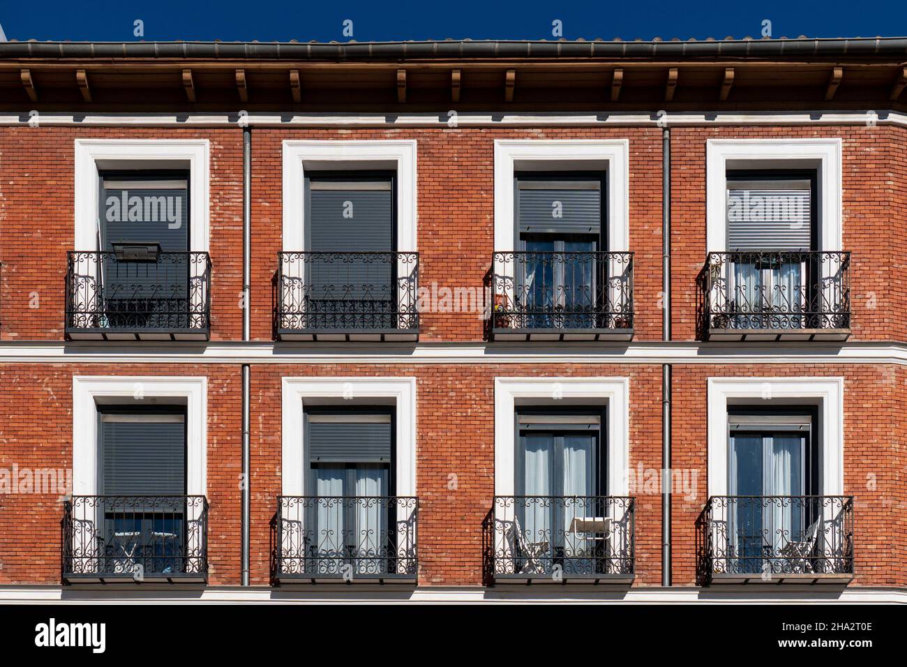 Brick Commercial Building faacde balconies Stock Photo - Alamy