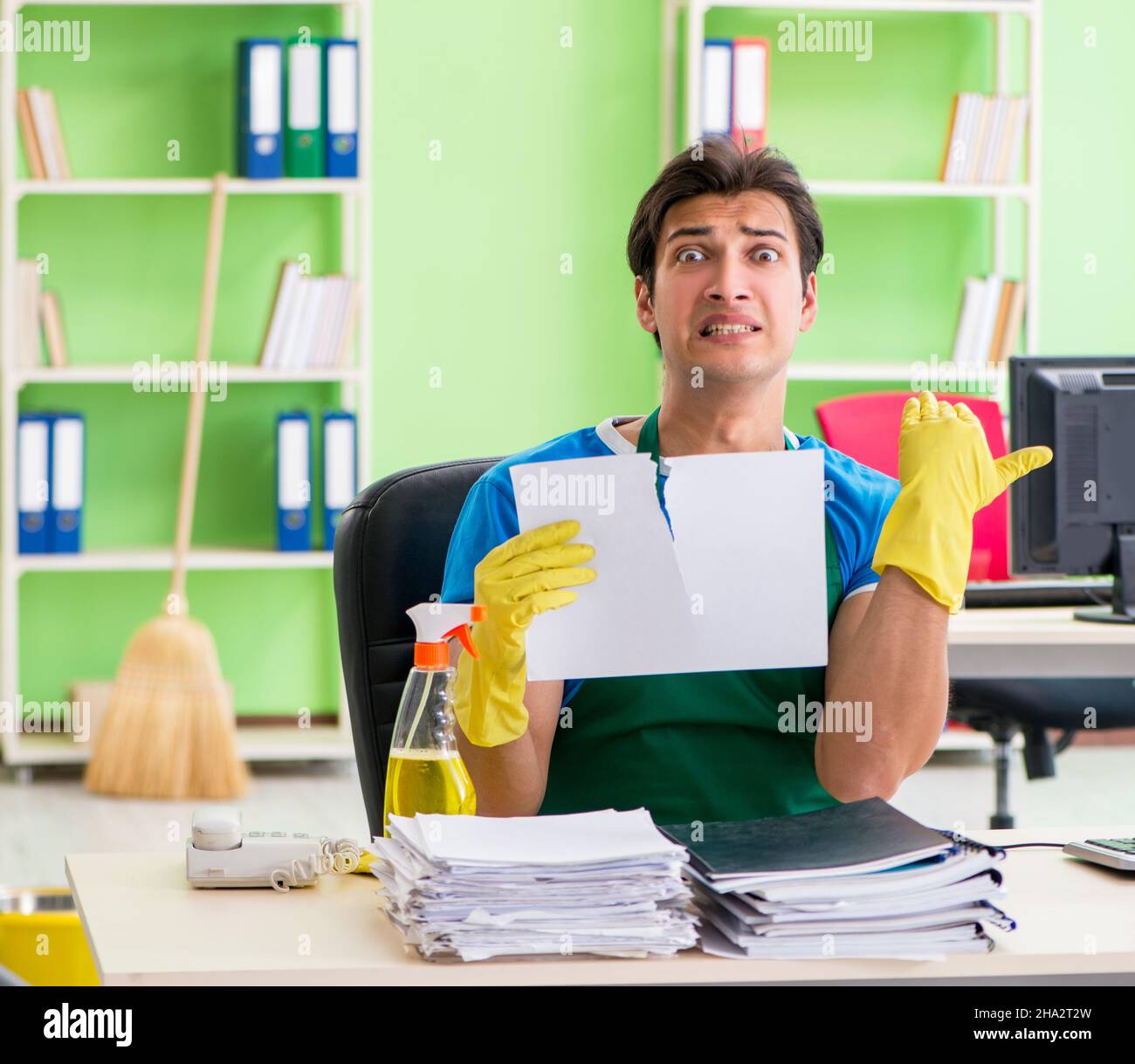 The male spy under cleaner cover stealing confidential documents Stock ...