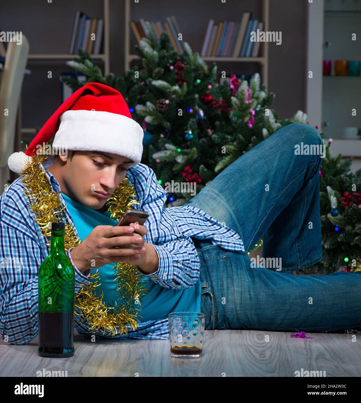The man celebrating christmas at home alone Stock Photo - Alamy