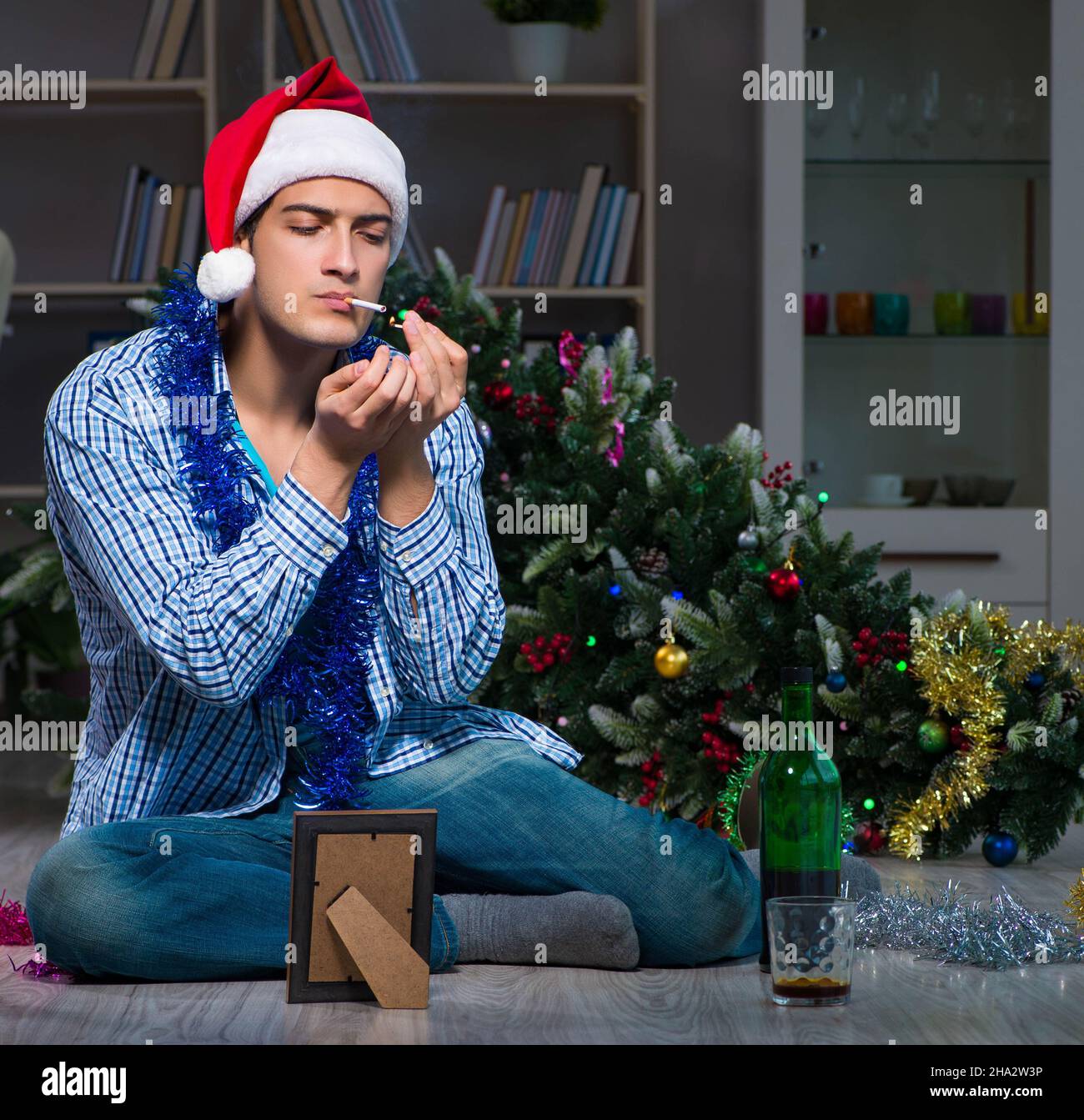 The man celebrating christmas at home alone Stock Photo - Alamy