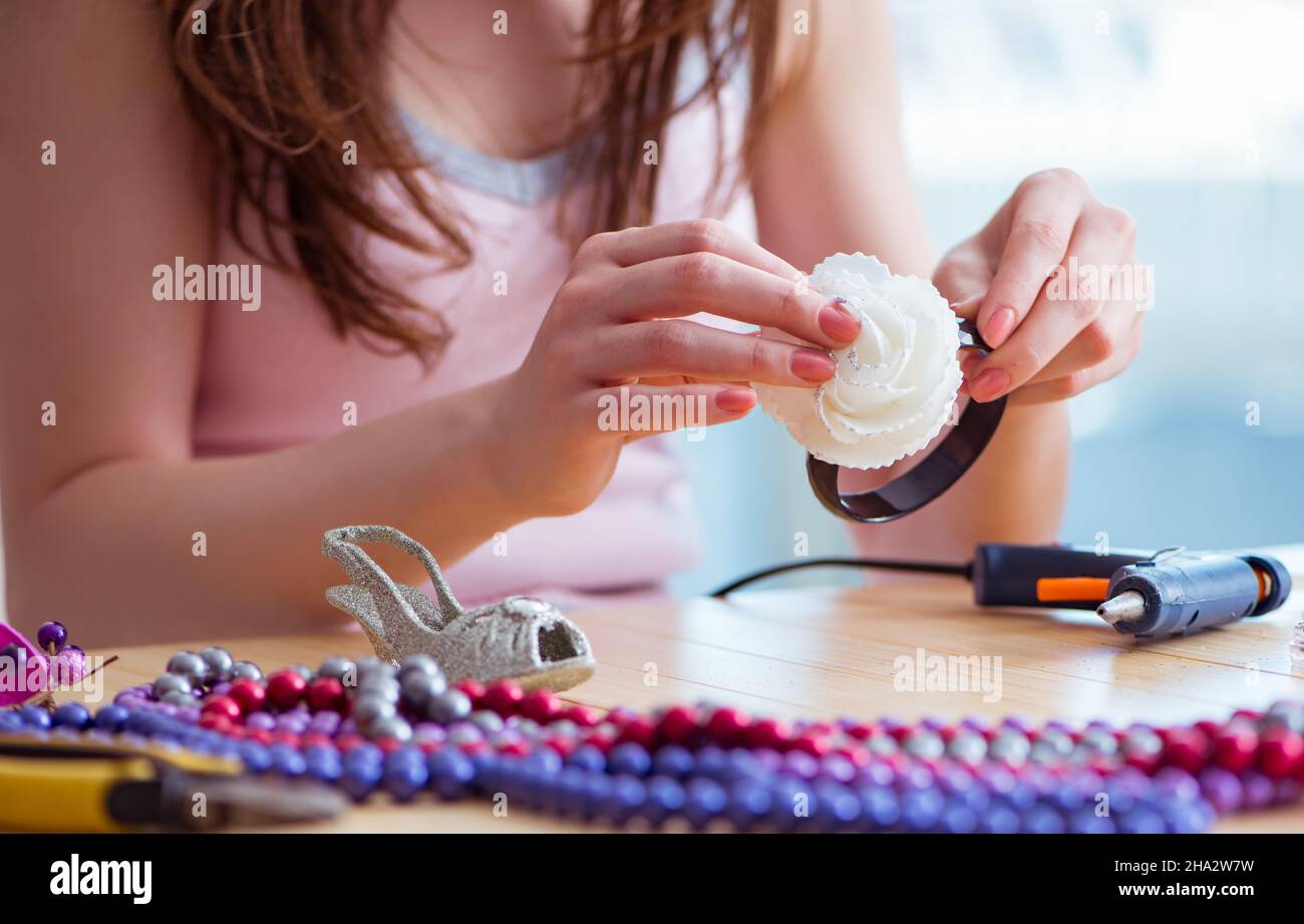 The woman making jewelry at home Stock Photo - Alamy