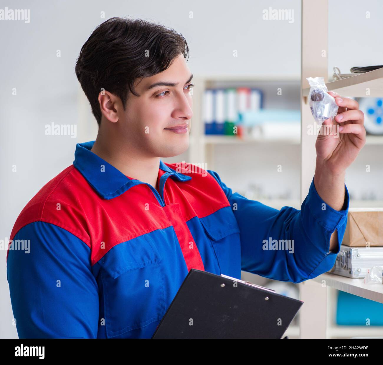 The man working in the postal warehouse Stock Photo - Alamy