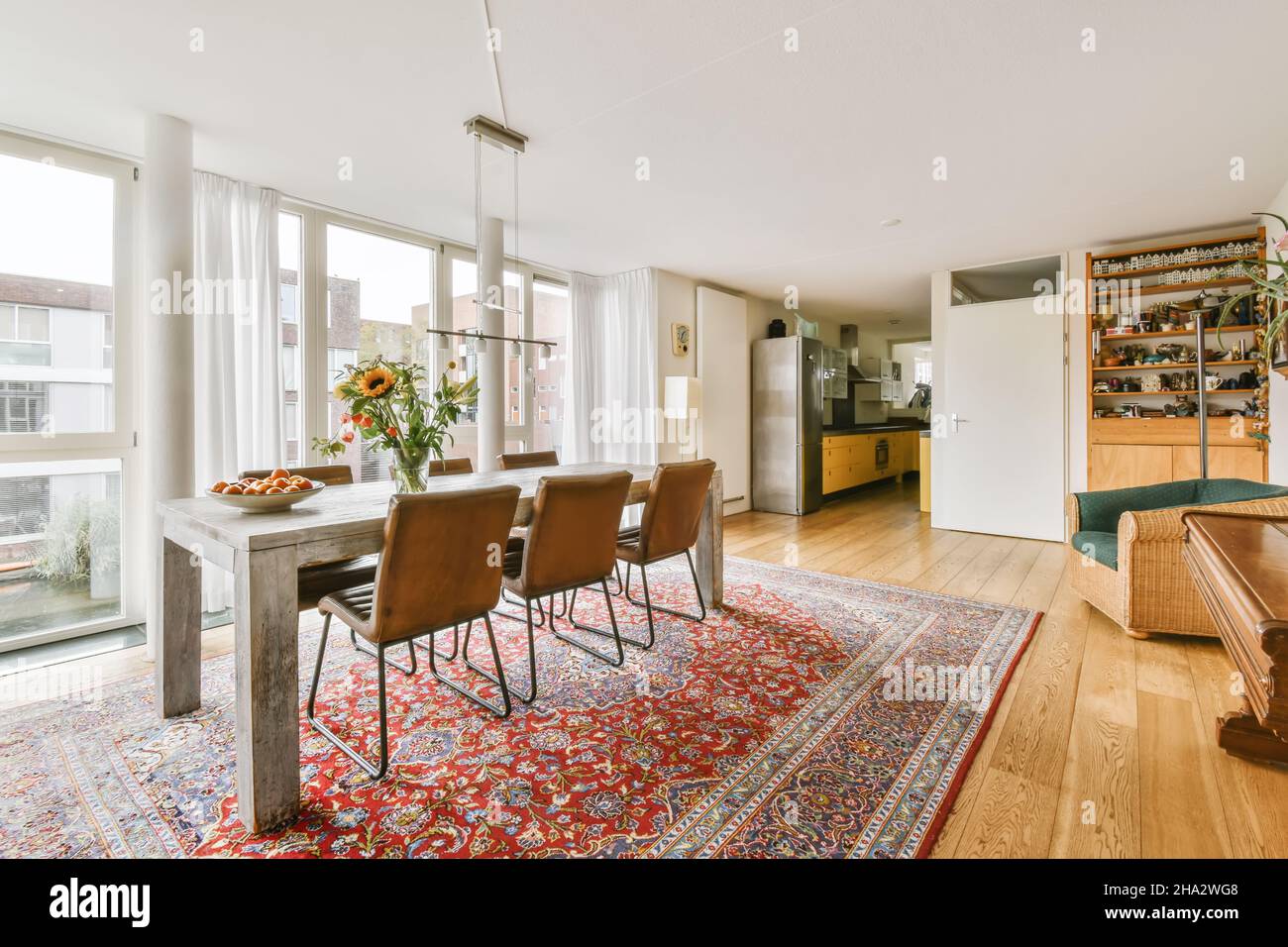 Lovely expansive dining area with large table and large full-length ...