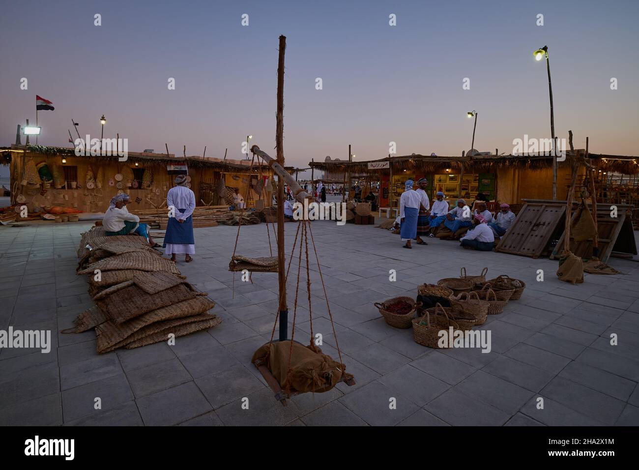 Group of Traditional Arabic fishermen sitting in Katara cultural ...