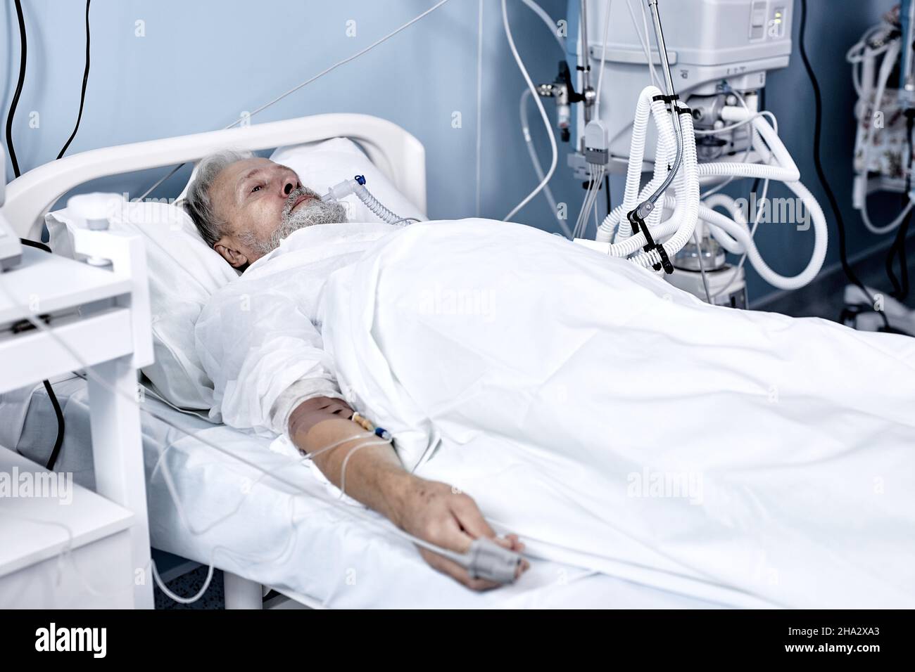 caucasian european senior male Patient on bed in private room in ...