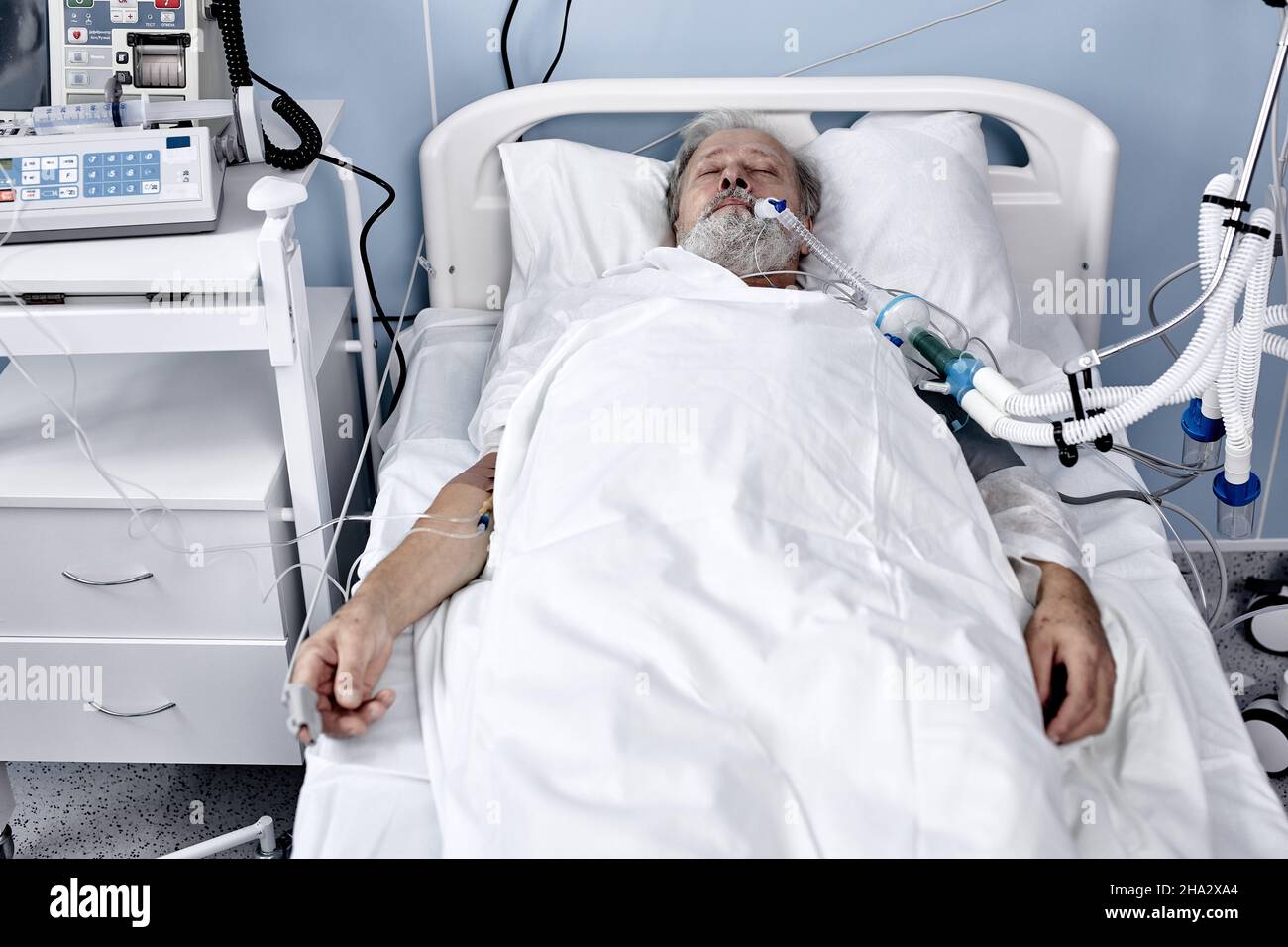 european elderly male Patient on bed in private room in hospital ...