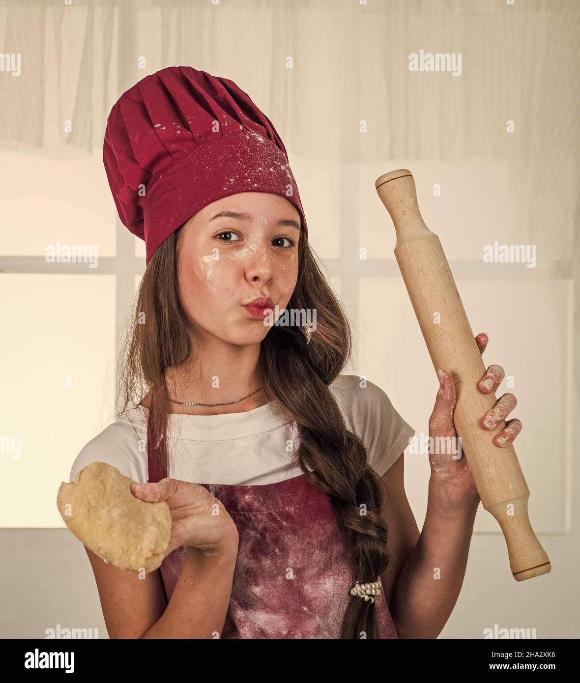 teen girl in cook uniform prepare food in kitchen, culinary Stock Photo ...