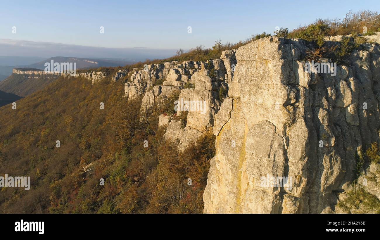 Top view of cliffs in morning sun. Shot. Picturesque panorama of rock ...