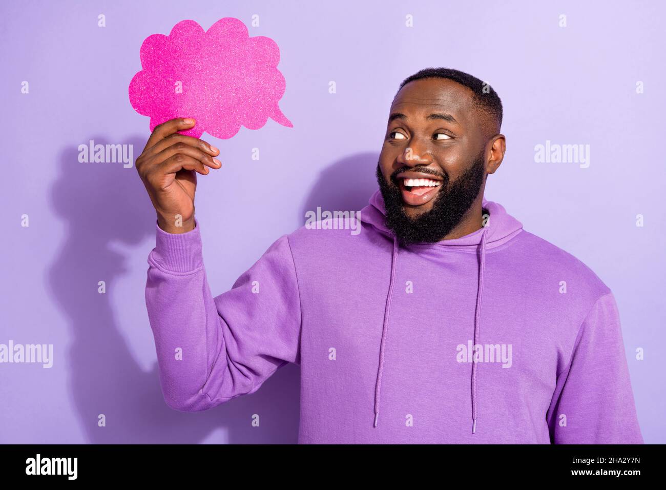 Portrait of attractive cheerful guy holding card copy space point of ...