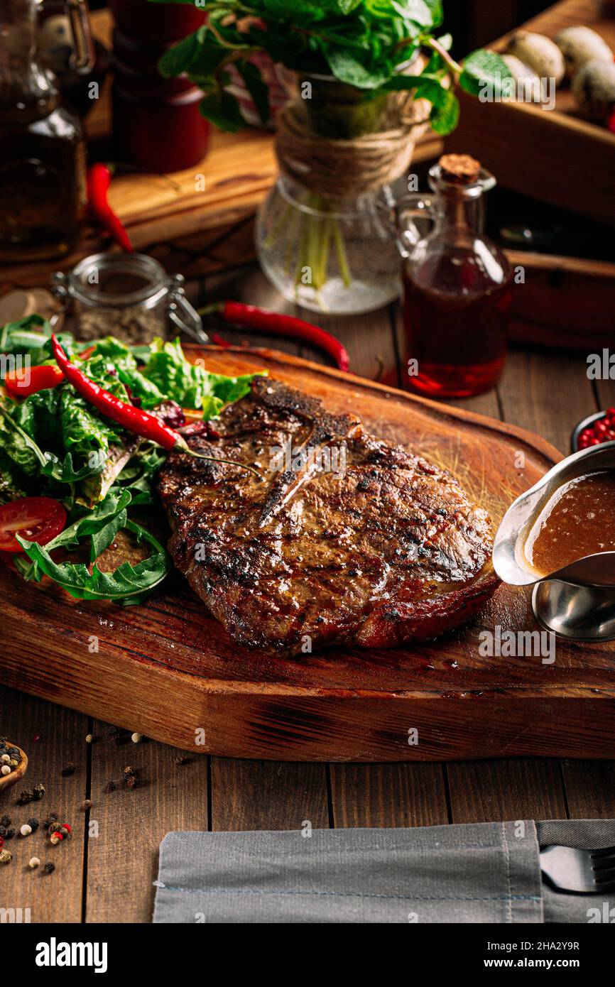 Grilled beef ribeye steak with pepper sauce Stock Photo - Alamy