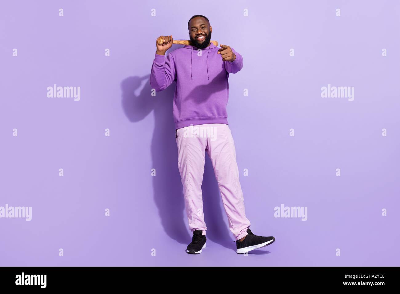 Full length body size view of attractive cheerful cool guy holding bat ...