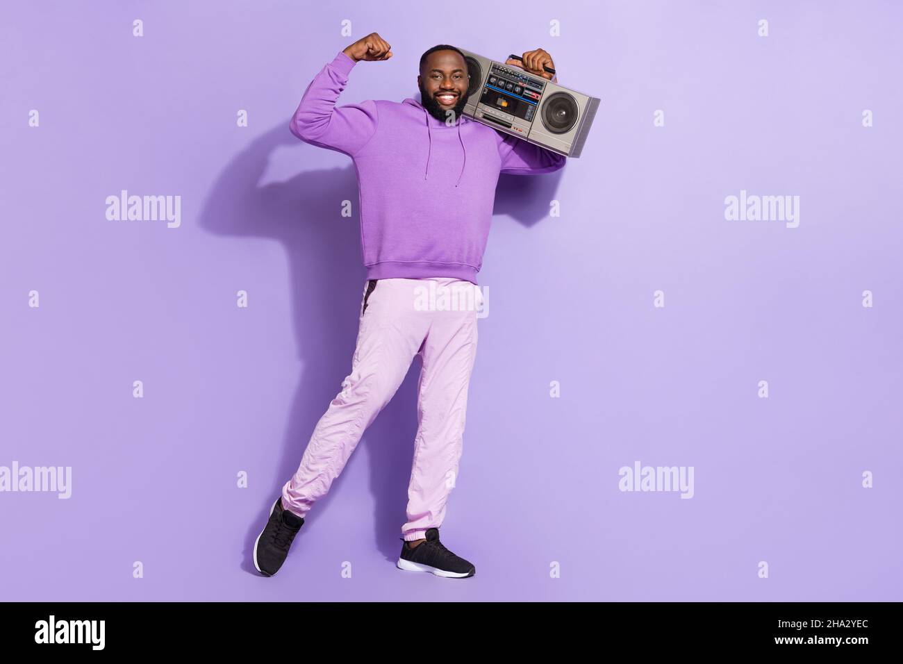 Full length body size view of attractive cheerful cool guy holding ...