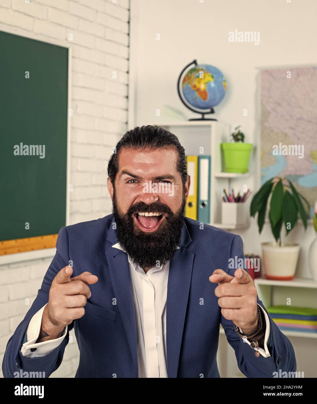 happy and successful teacher man in classroom, school education Stock ...